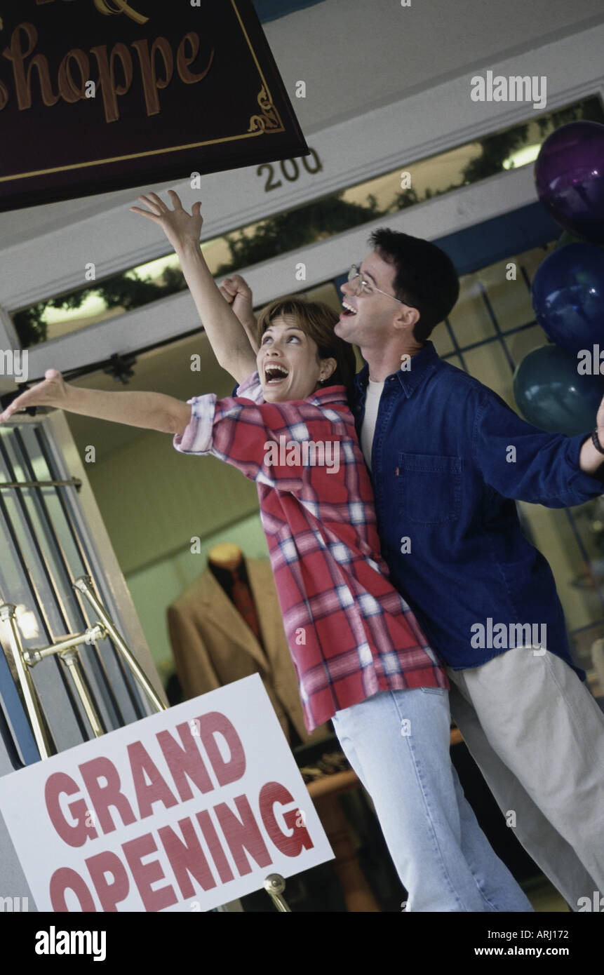 Couple grand opening sign hi-res stock photography and images - Alamy