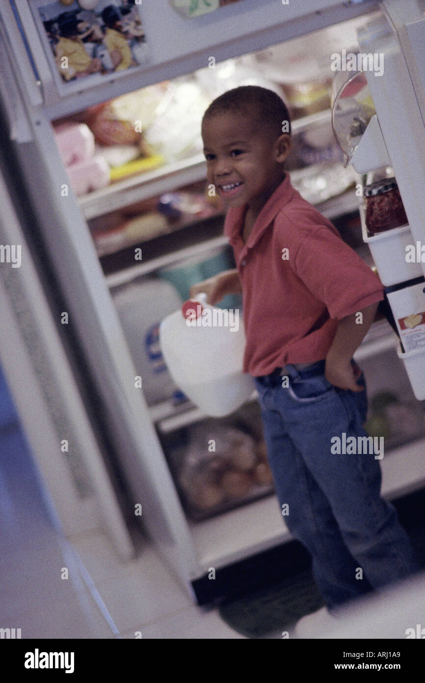 Boy refrigerator smiling hi-res stock photography and images - Alamy