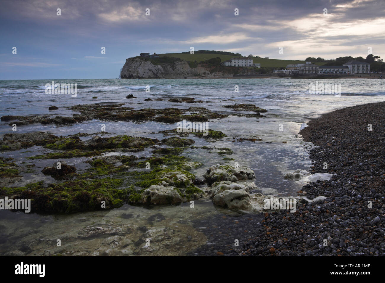 Freshwater Bay looking across the bay to the hotels and Tennyson Down ...