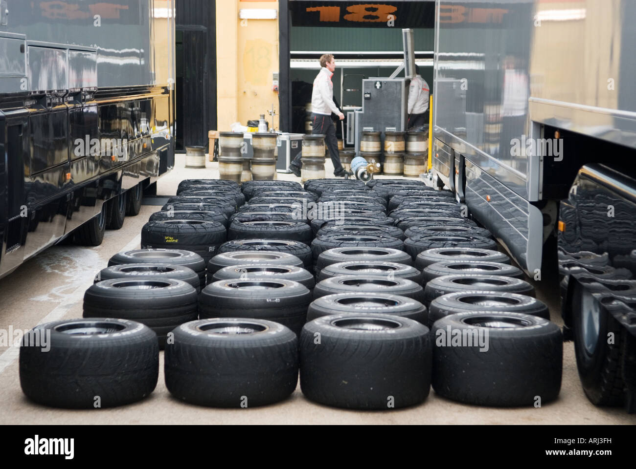 neatly stacked racetires between McLaren Team Trucks during Formula 1 ...