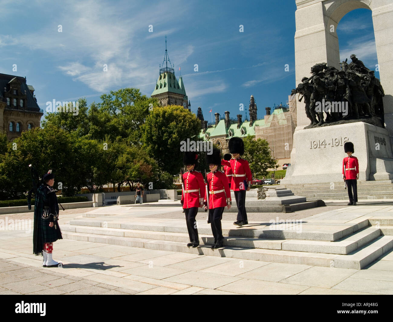 The changing of the guard at the War Memorial at Confederation Square ...