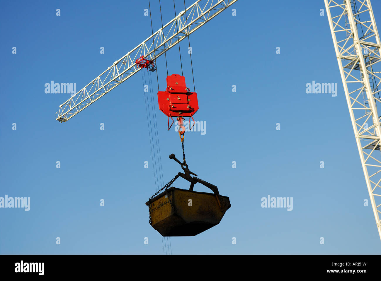 Crane with Skip Stock Photo - Alamy