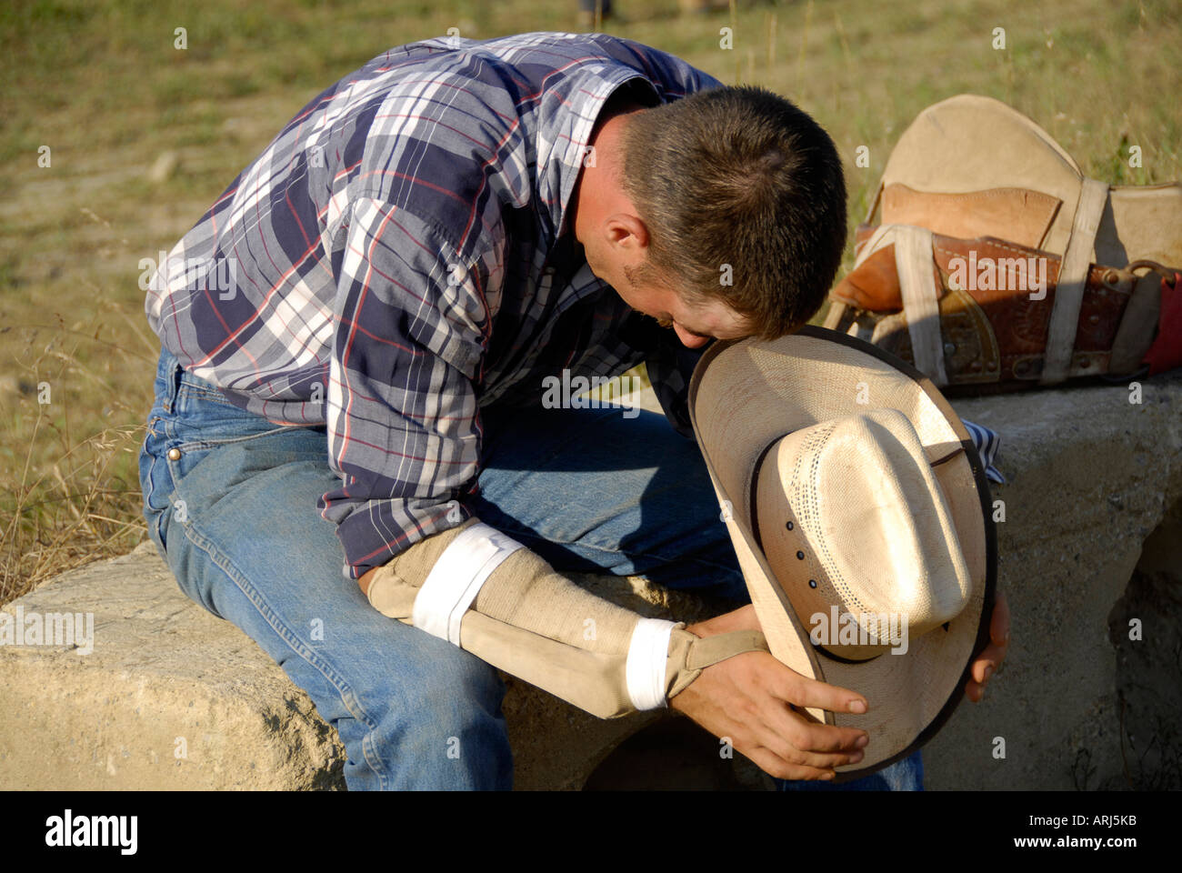 Cowboy praying with horse hi-res stock photography and images - Alamy