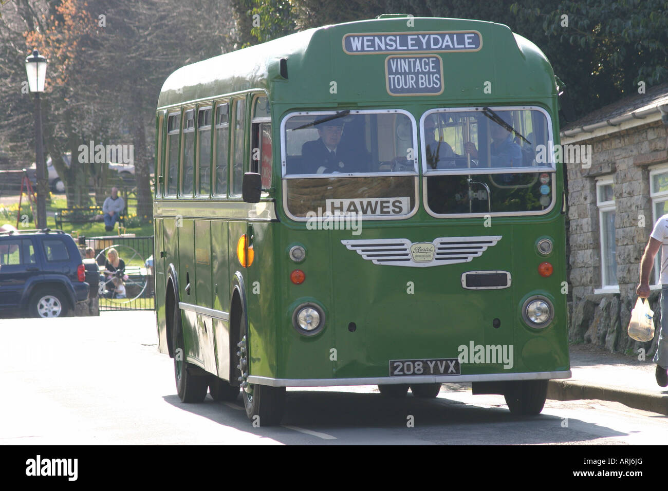 green old bus for railway station hawes village Stock Photo - Alamy