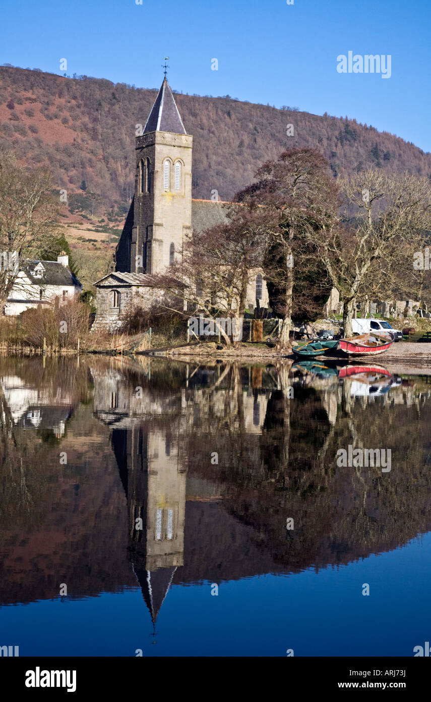 A mirror like reflection on the Lake of Menteith at Port of Menteith ...
