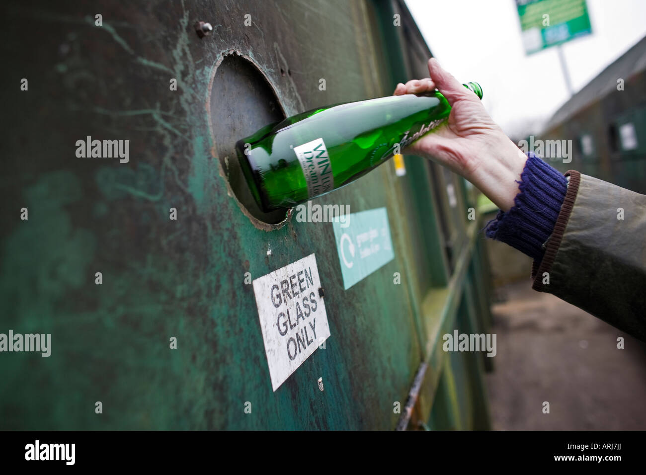 Green glass recycling bin at a recycling centre, UK Stock Photo - Alamy