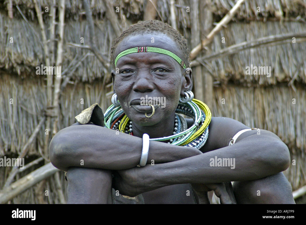 Toposa woman with scars, piercing and pearl necklaces, Sudan Stock ...