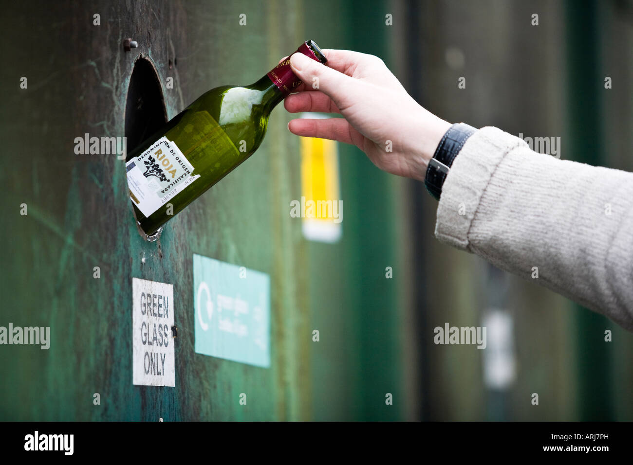 Green glass recycling bin at a recycling centre, UK Stock Photo - Alamy
