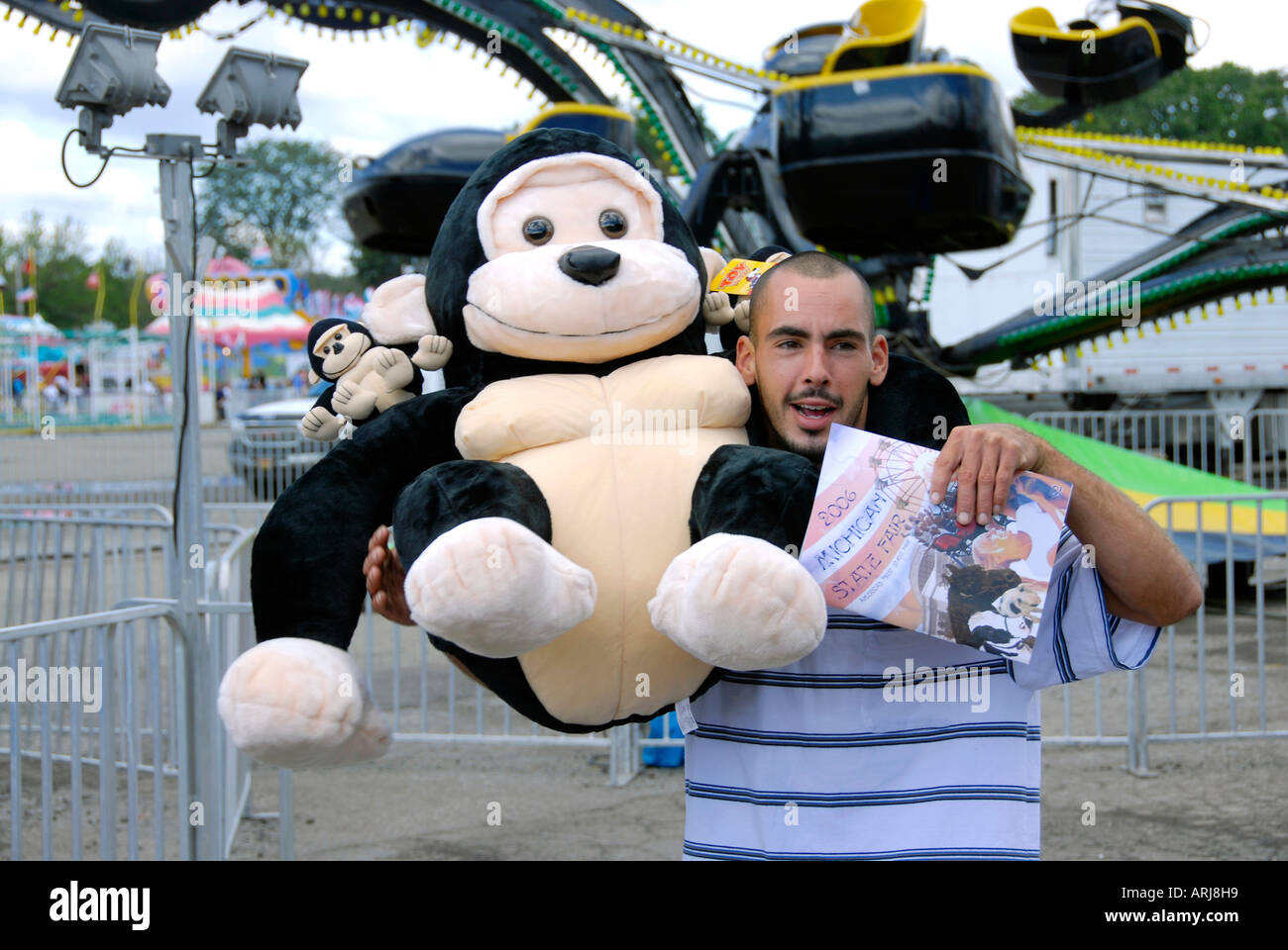 Adult male wins a large stuffed animal at the Michigan State Fair Held ...