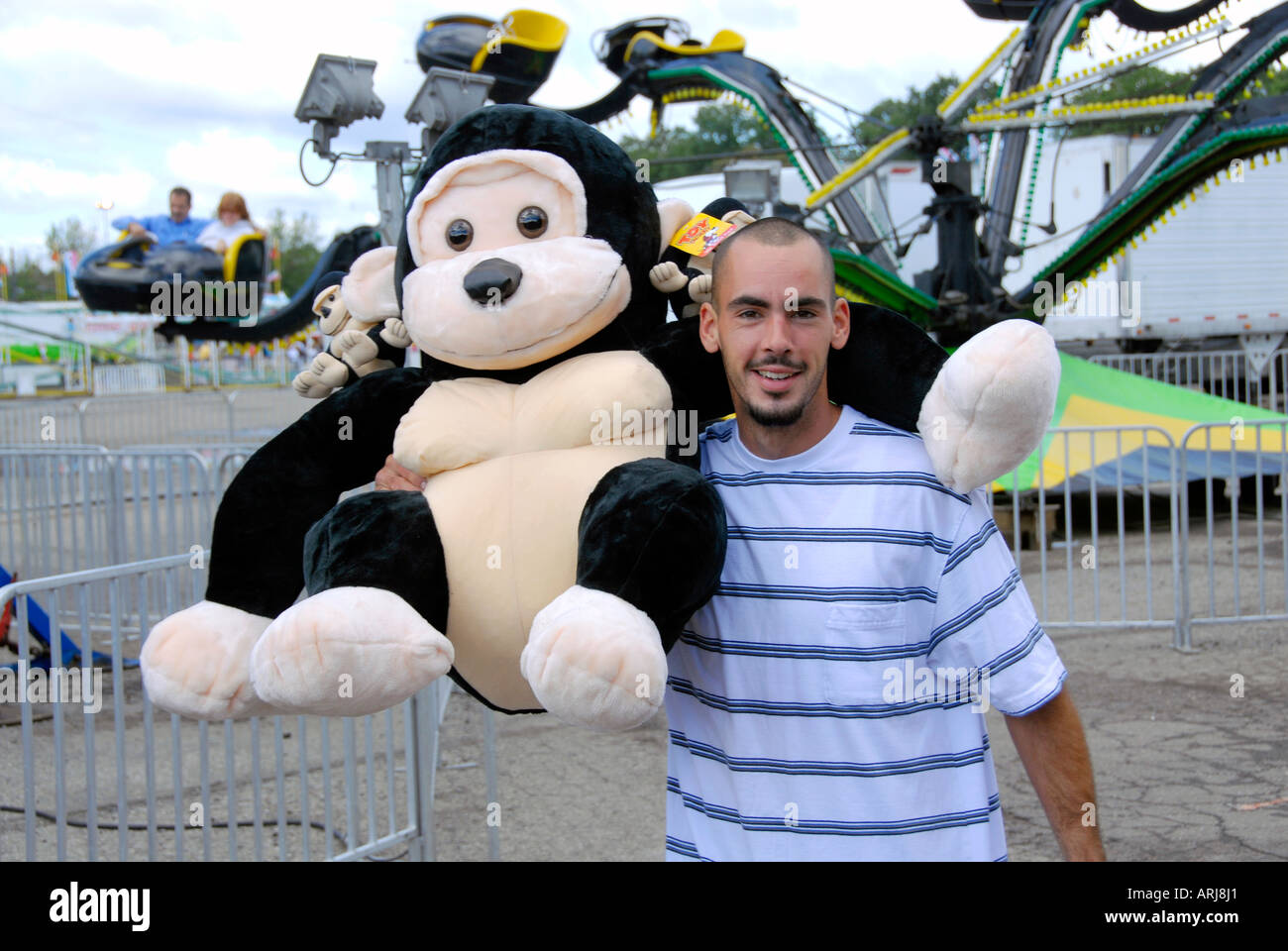 Adult male wins a large stuffed animal at the Michigan State Fair Held ...