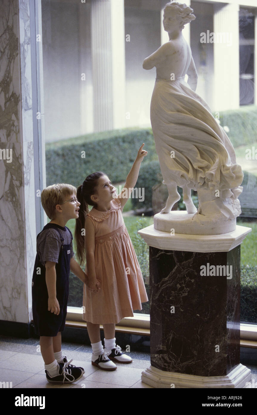 Children pointing at statue hi-res stock photography and images - Alamy