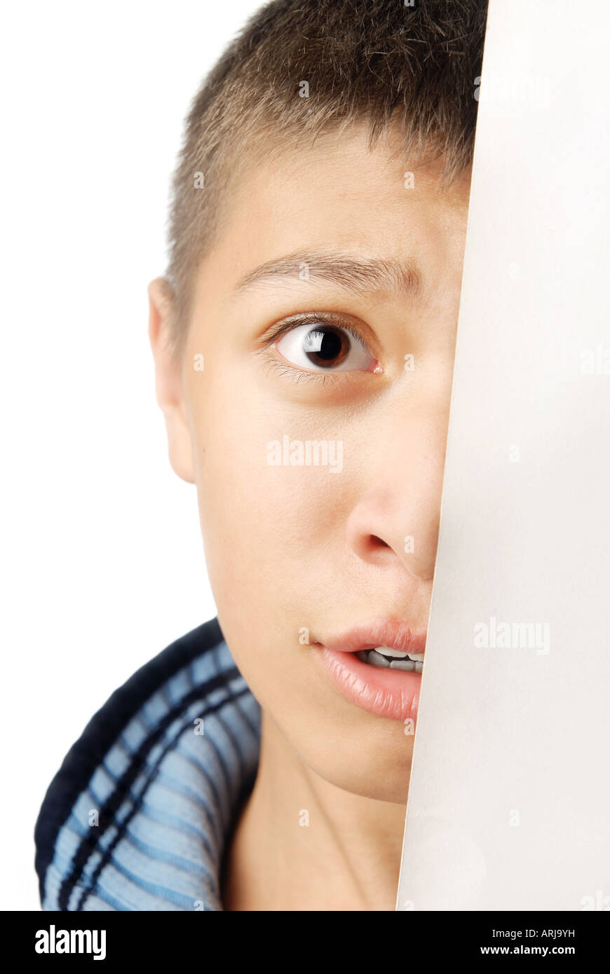 Hiding boy with fear expression on his face Stock Photo - Alamy