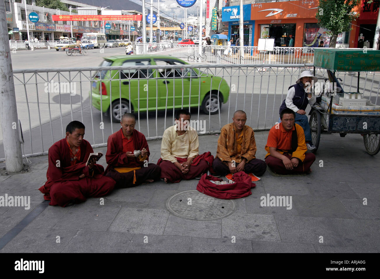 chanting monks asking for donations,lhasa,tibet,china Stock Photo - Alamy
