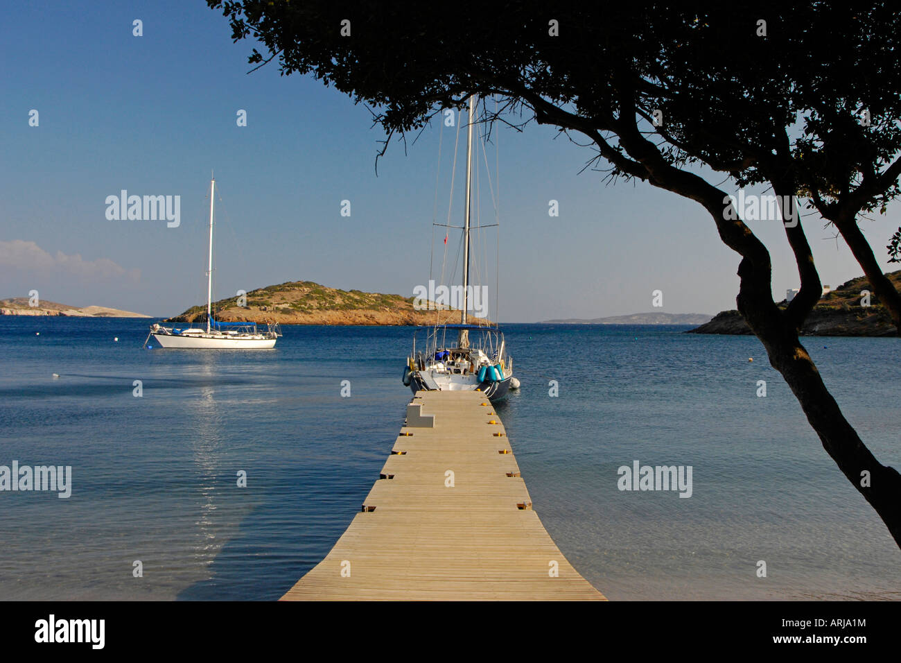 Sailboats in harbor on Marathi, Dodecanese, Aegean Sea, Greece Stock ...