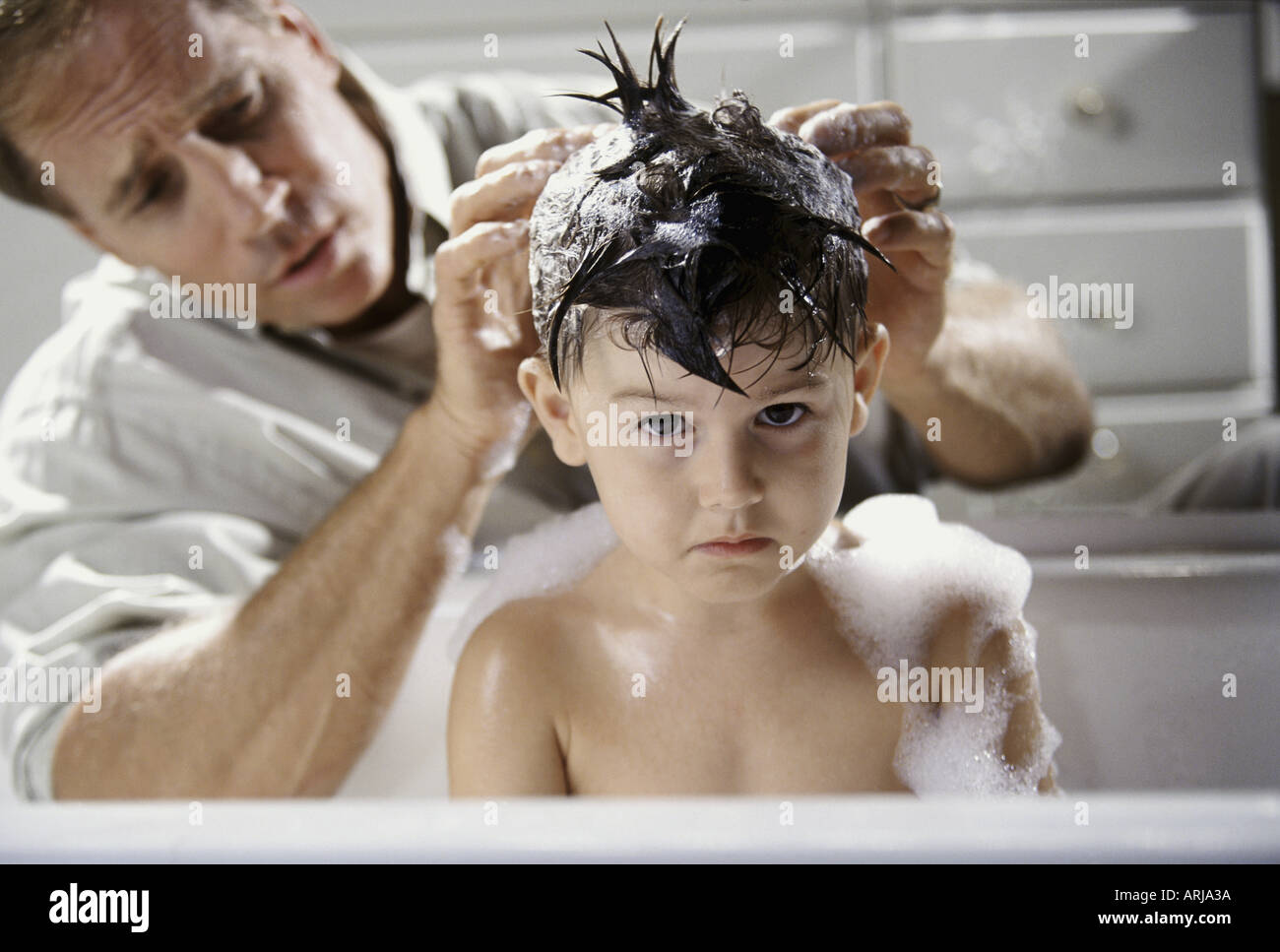 Father bathing his son hi-res stock photography and images - Alamy