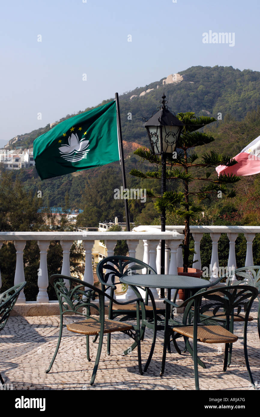 Macau Flag waving in outdoor seating area on Coloane Island, Macau ...