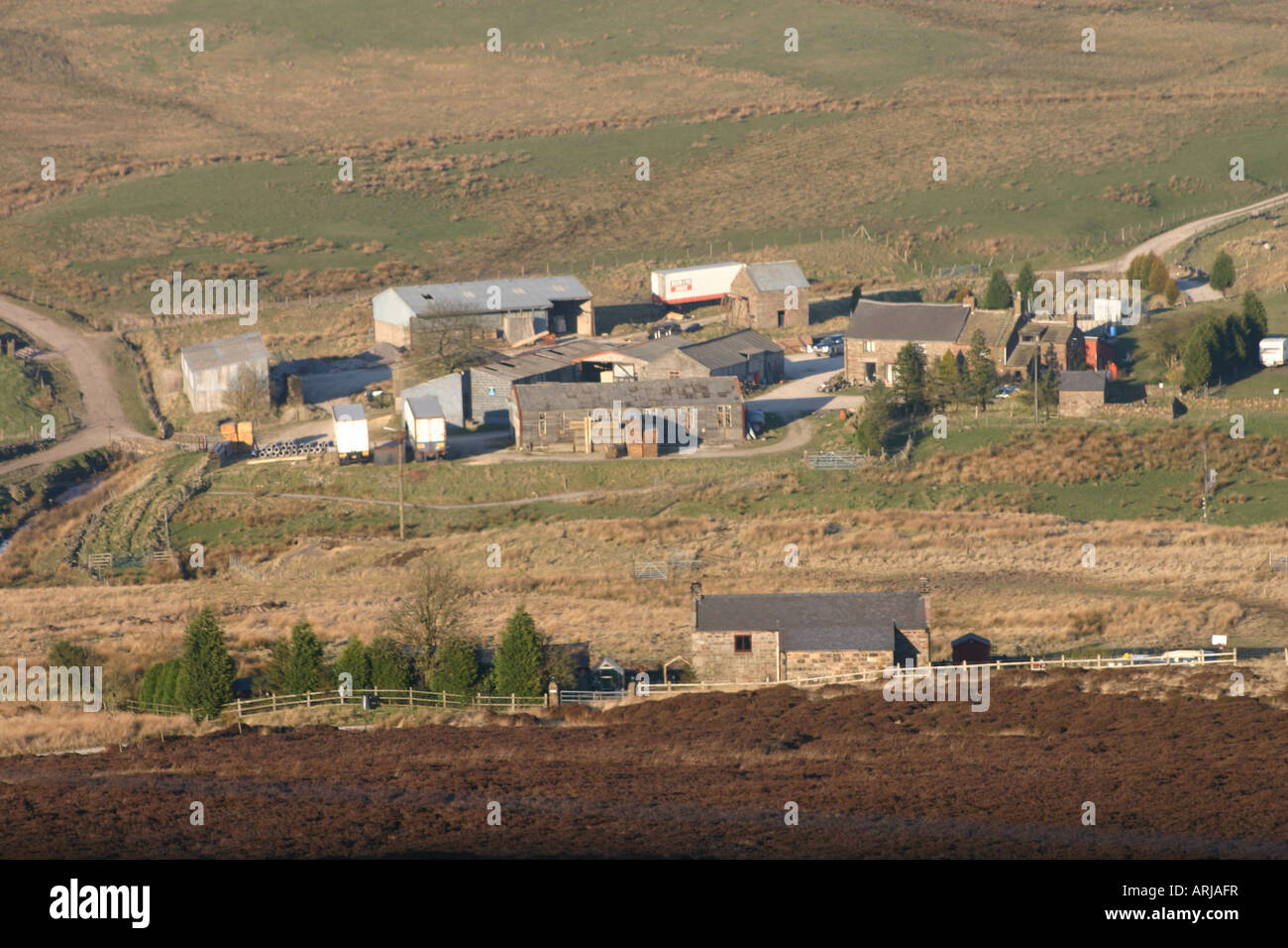 sheep farming fields stone farm buildings slope Stock Photo - Alamy