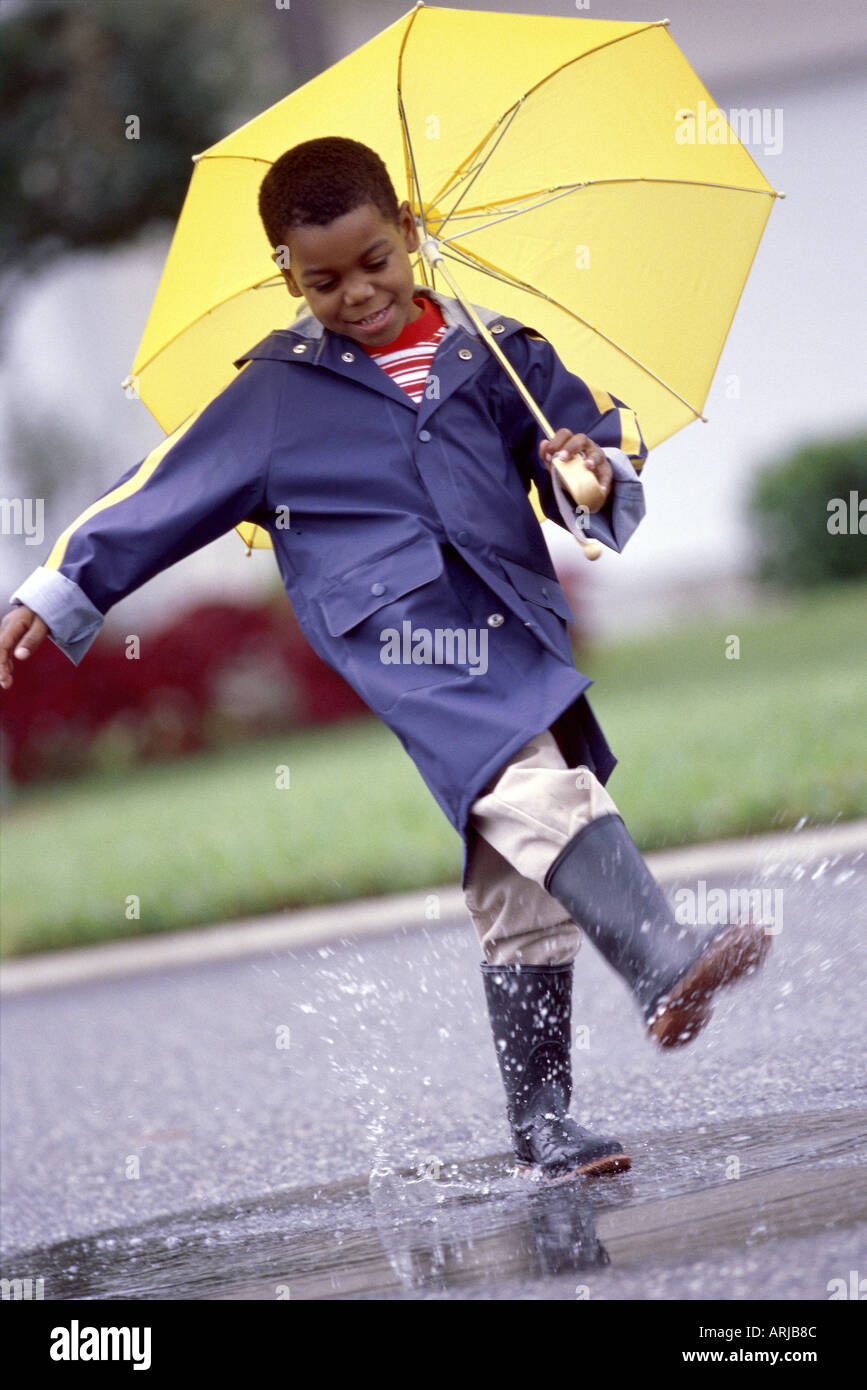 Child rain puddle african hi-res stock photography and images - Alamy