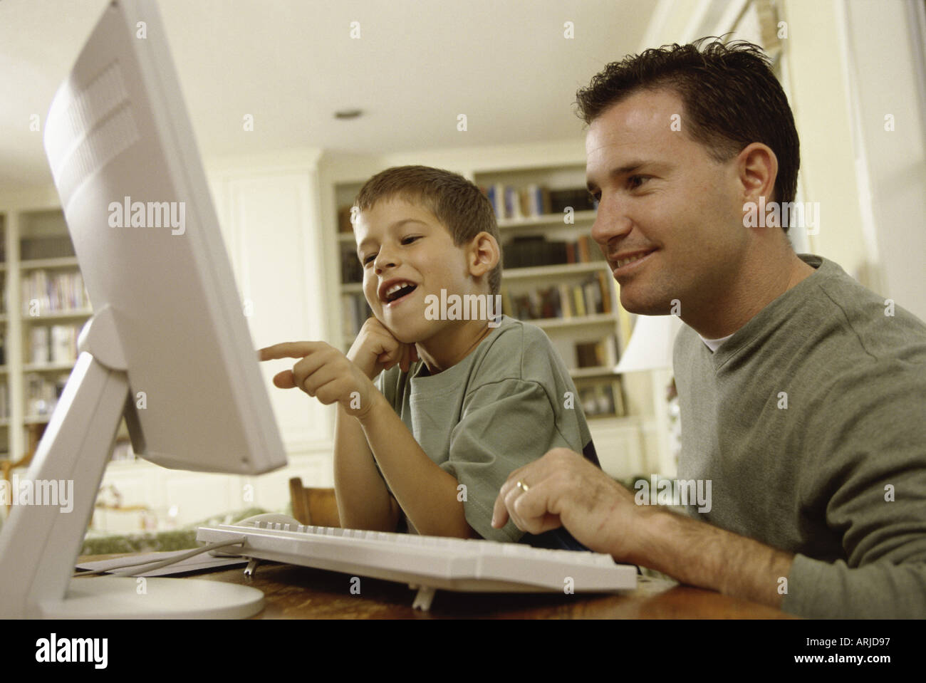 Father son using computers hi-res stock photography and images - Alamy