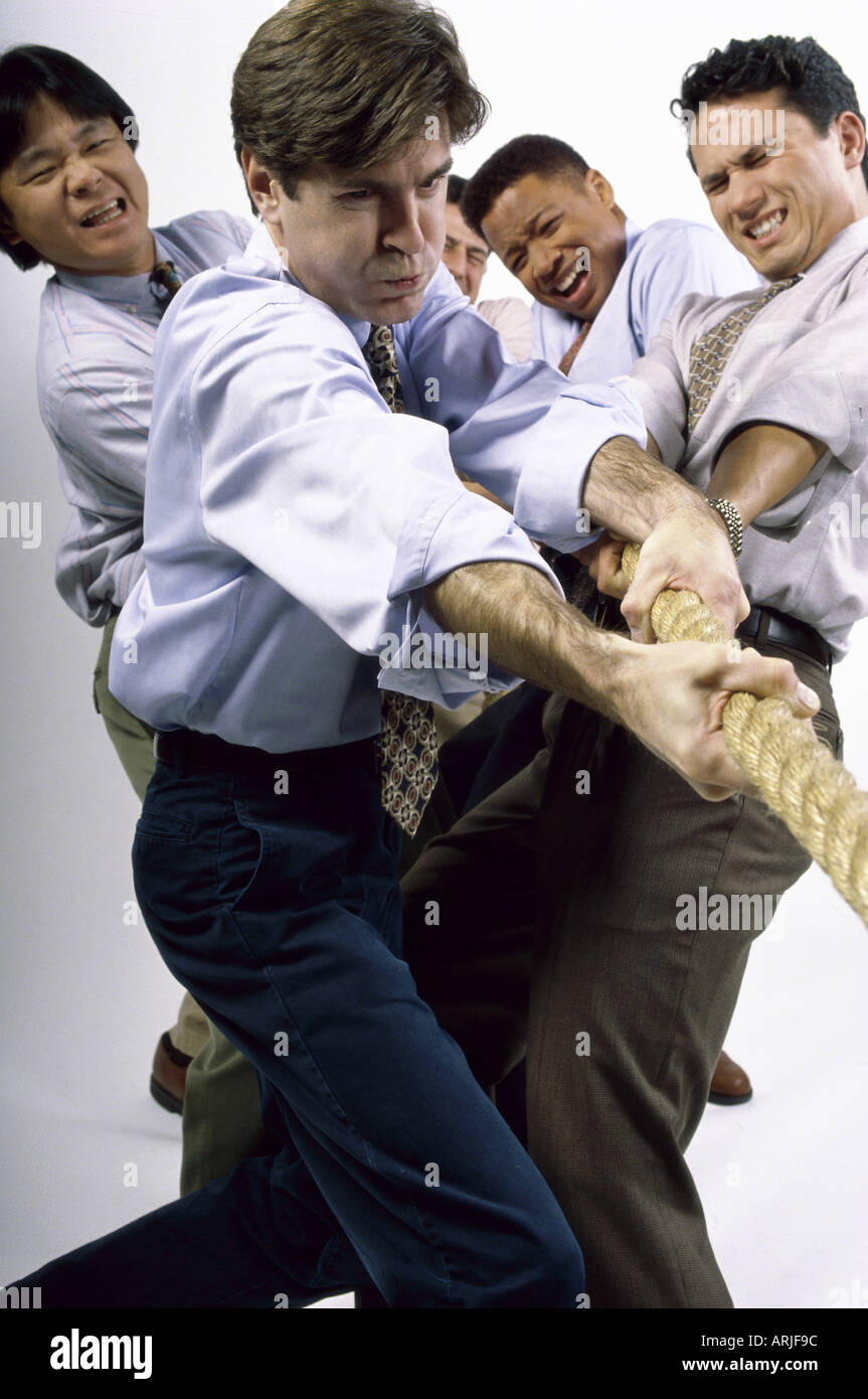 Businessmen Playing Tug of War Stock Photo - Alamy