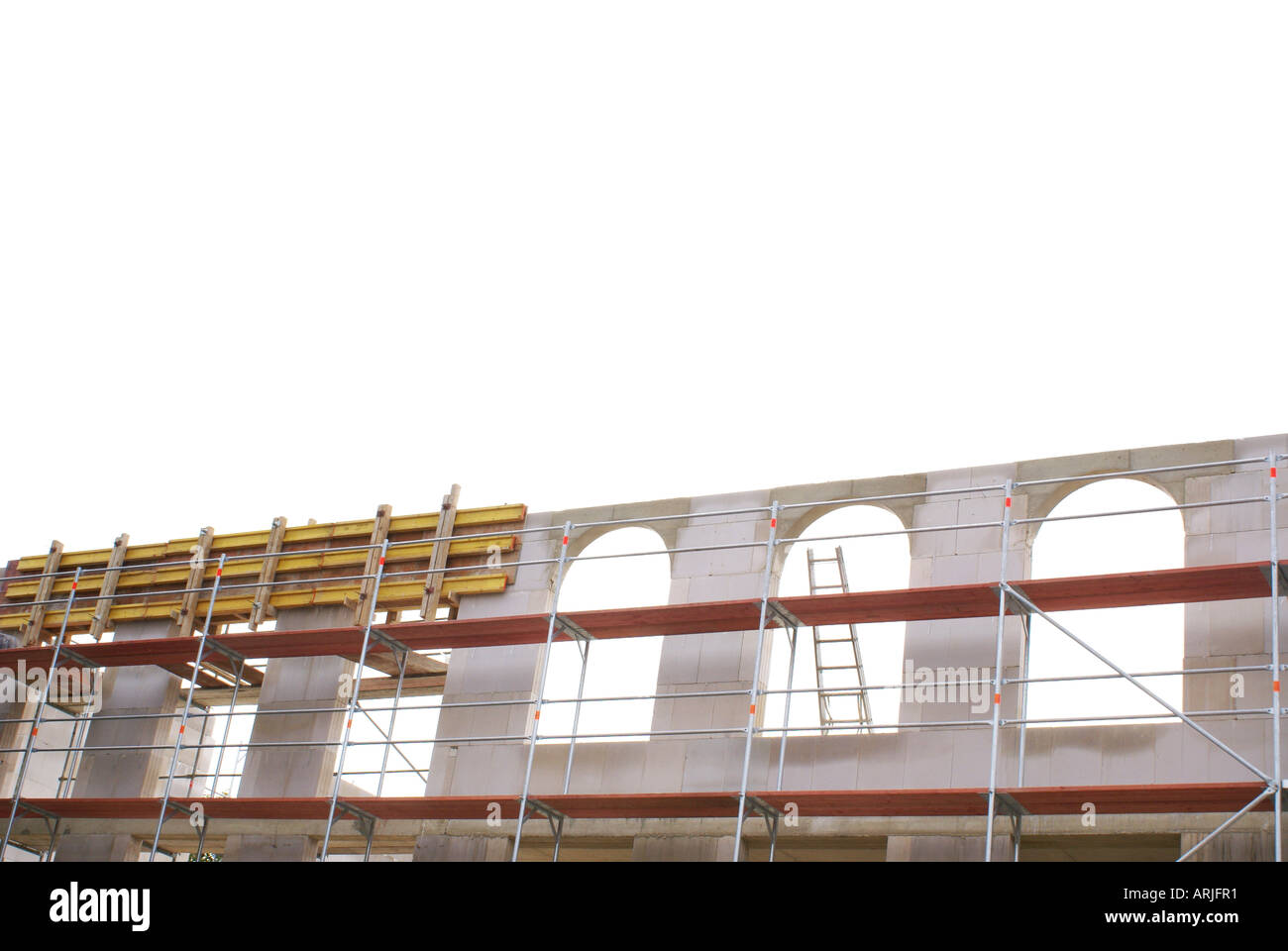 building under construction with scaffolding and wall being built Stock ...