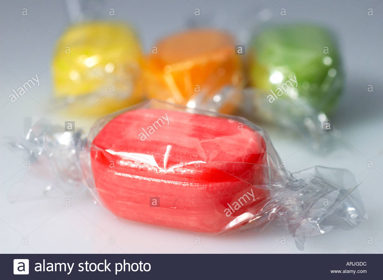Four coloured boiled sweets Stock Photo - Alamy