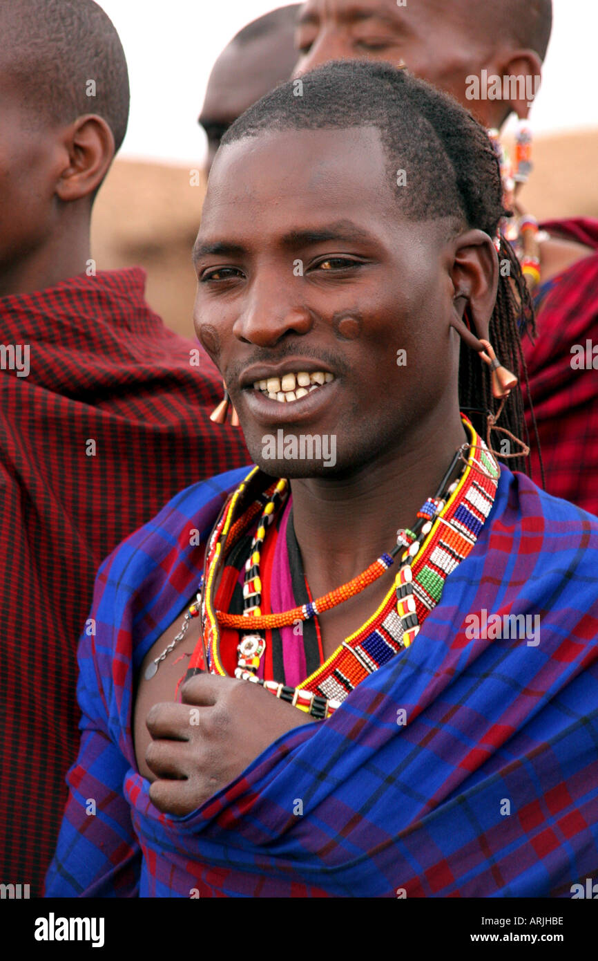 A portrait of a Maasai moran warrior, in tribal clothes, and with large ...