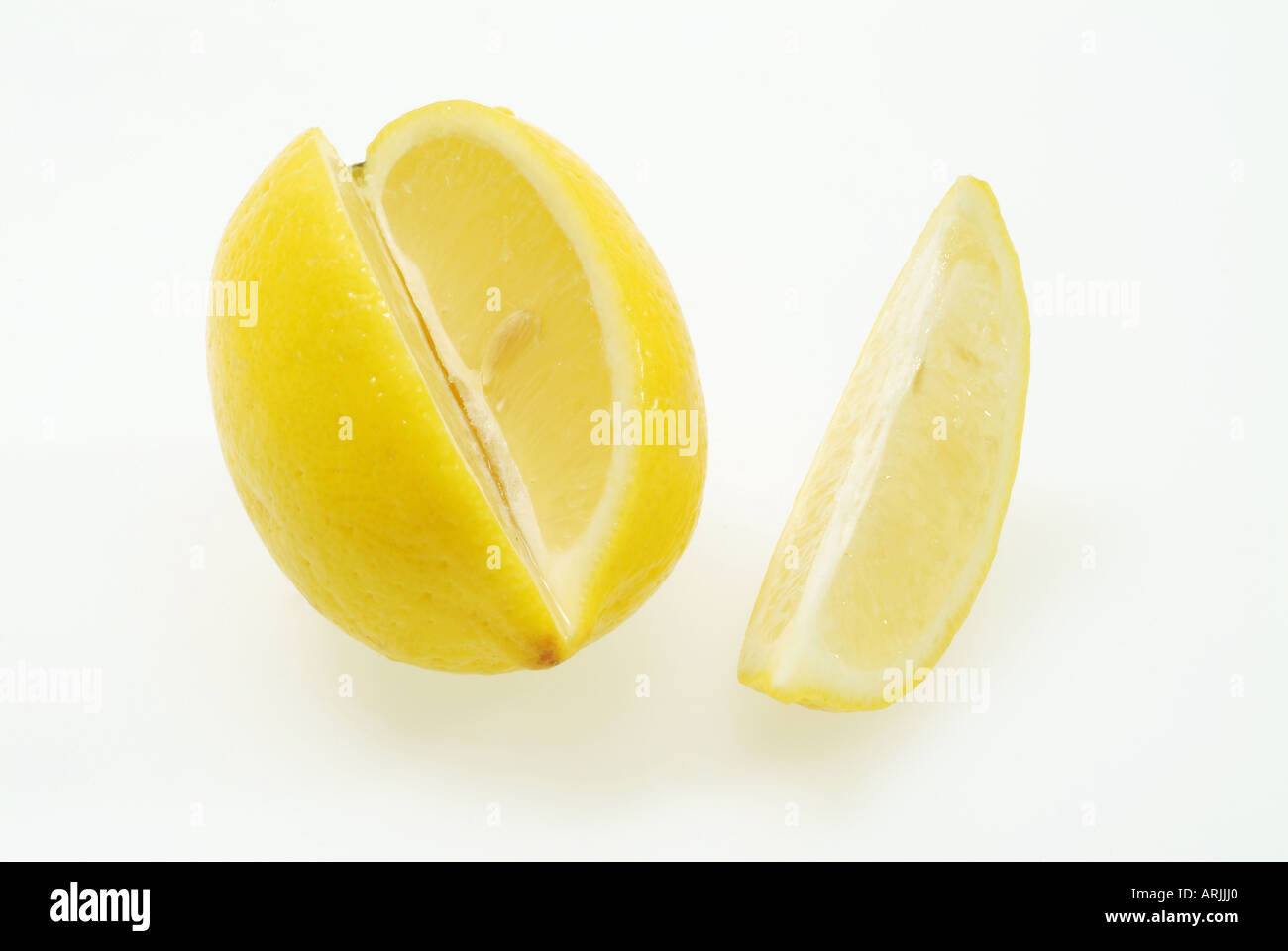 lemon with a slice cut out Stock Photo - Alamy