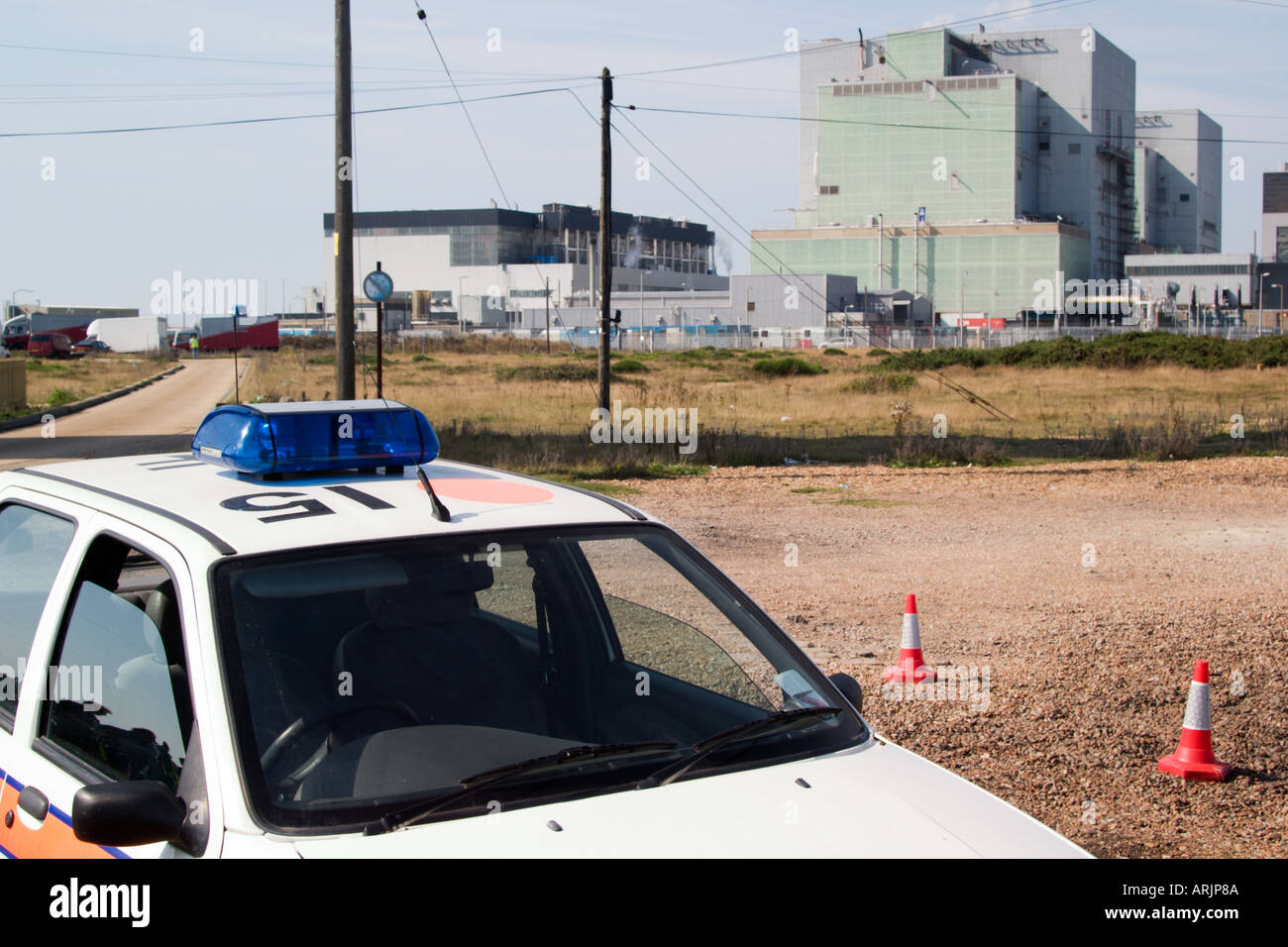 Security car in foreground with Nuclear Power Station in background ...