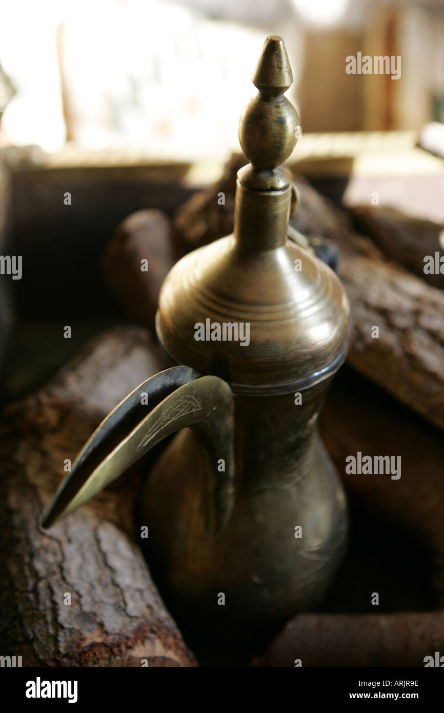 Making of traditional arabian coffee with cardamom . Qahwa masbuta ...