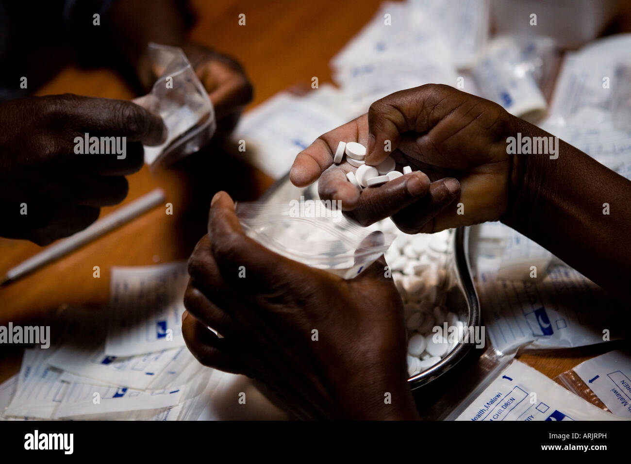 Pharmacist selecting drugs for patient Stock Photo - Alamy
