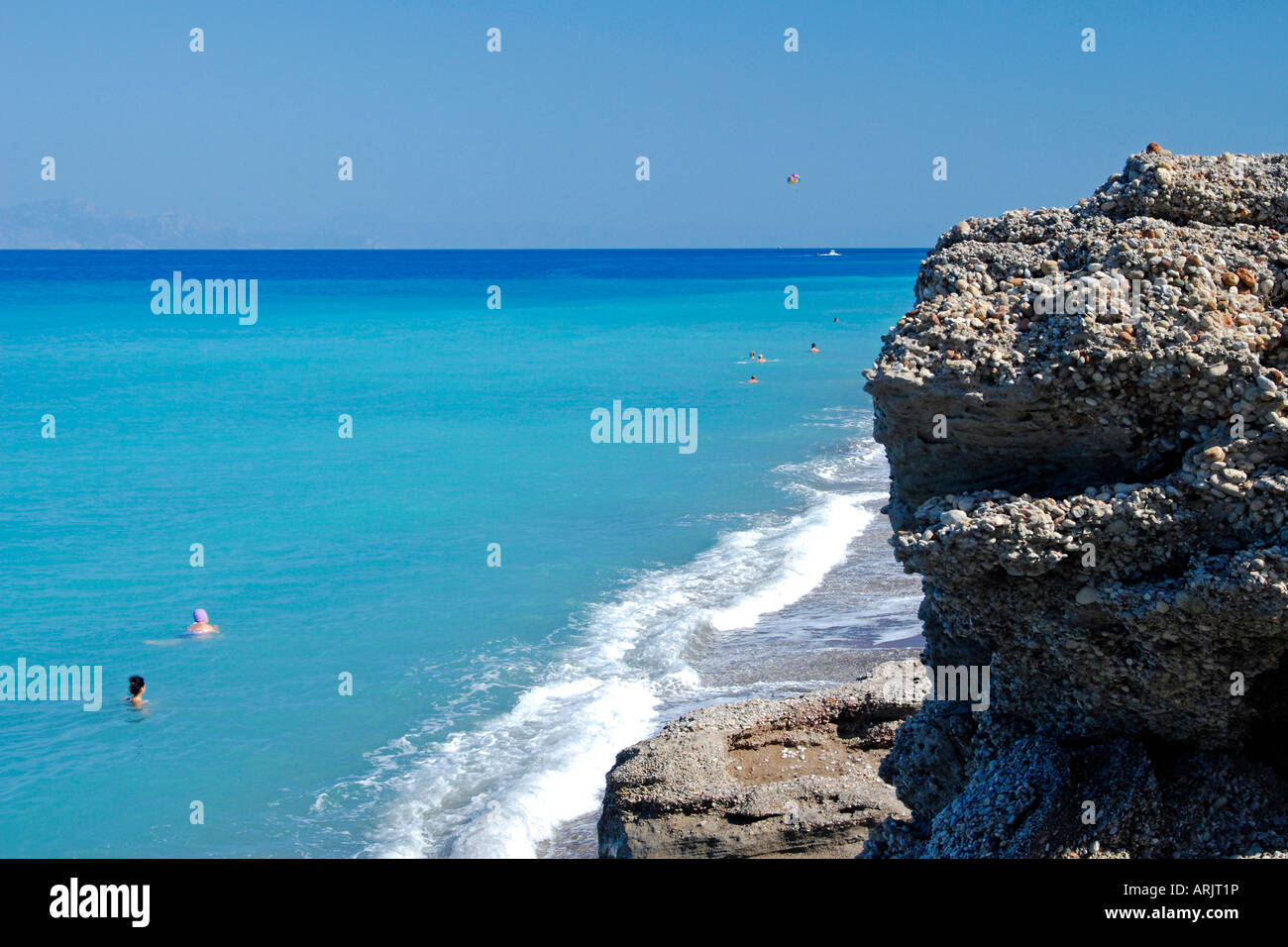 Tourists swimming on the northern coastline and beaches, Rhodes ...