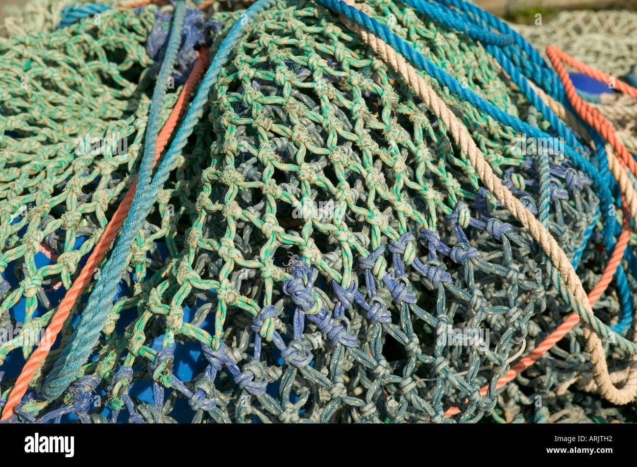 Fishing Nets hanging over harbour wall New Quay Ceredigion Wales Stock ...
