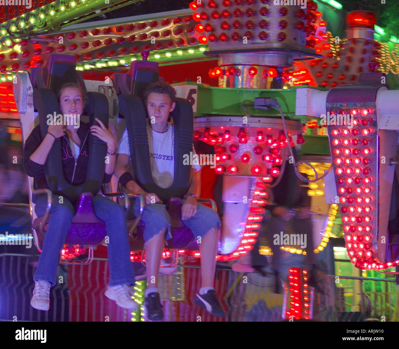 On a ride at the funfair Stock Photo - Alamy