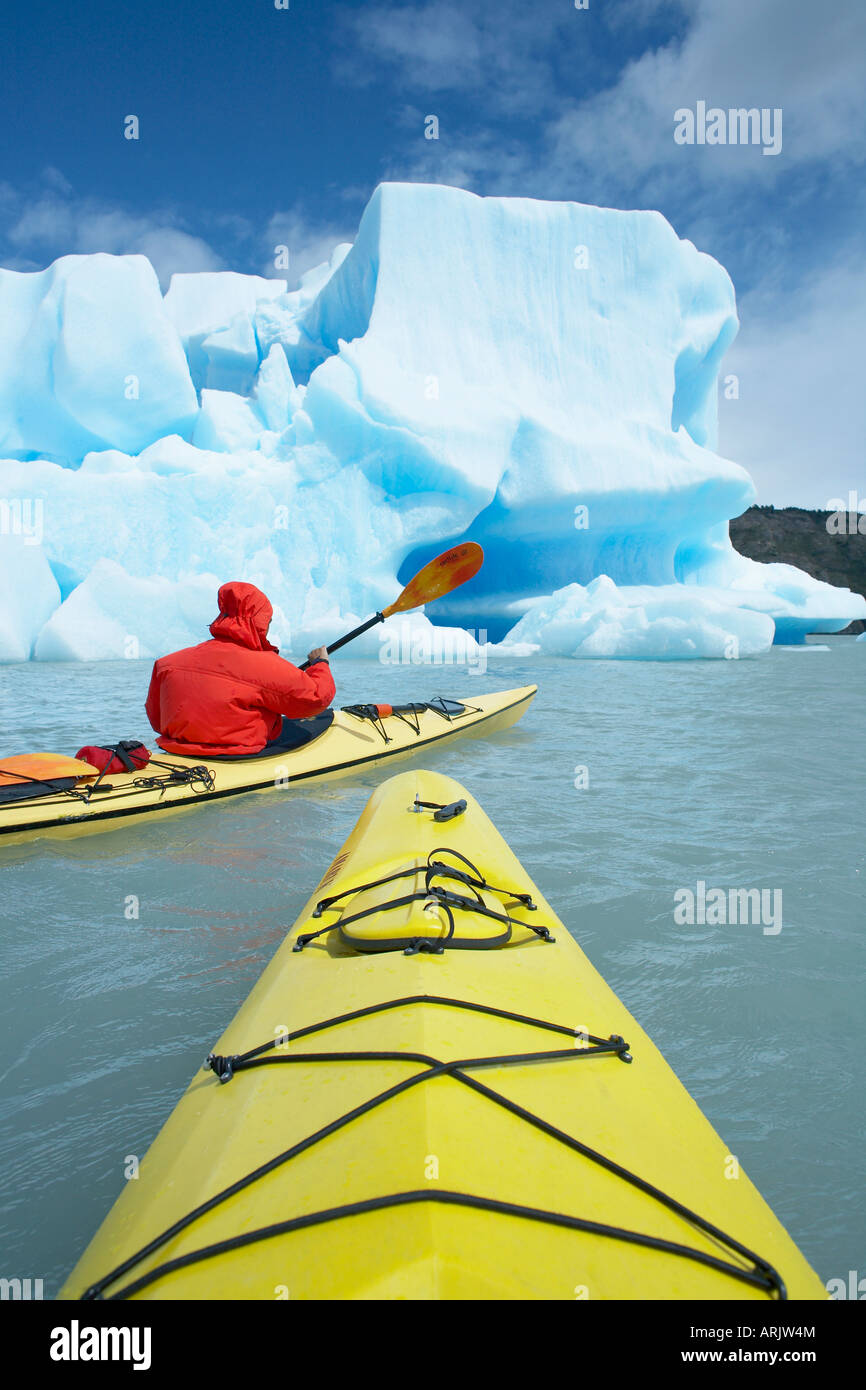 Person kayaking near icebergs, Lago Gray (Lake Gray) (Lake Grey ...