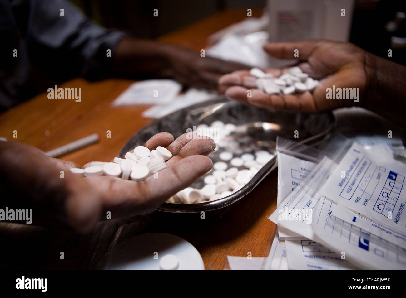 Pharmacist selecting drugs for patient Stock Photo - Alamy