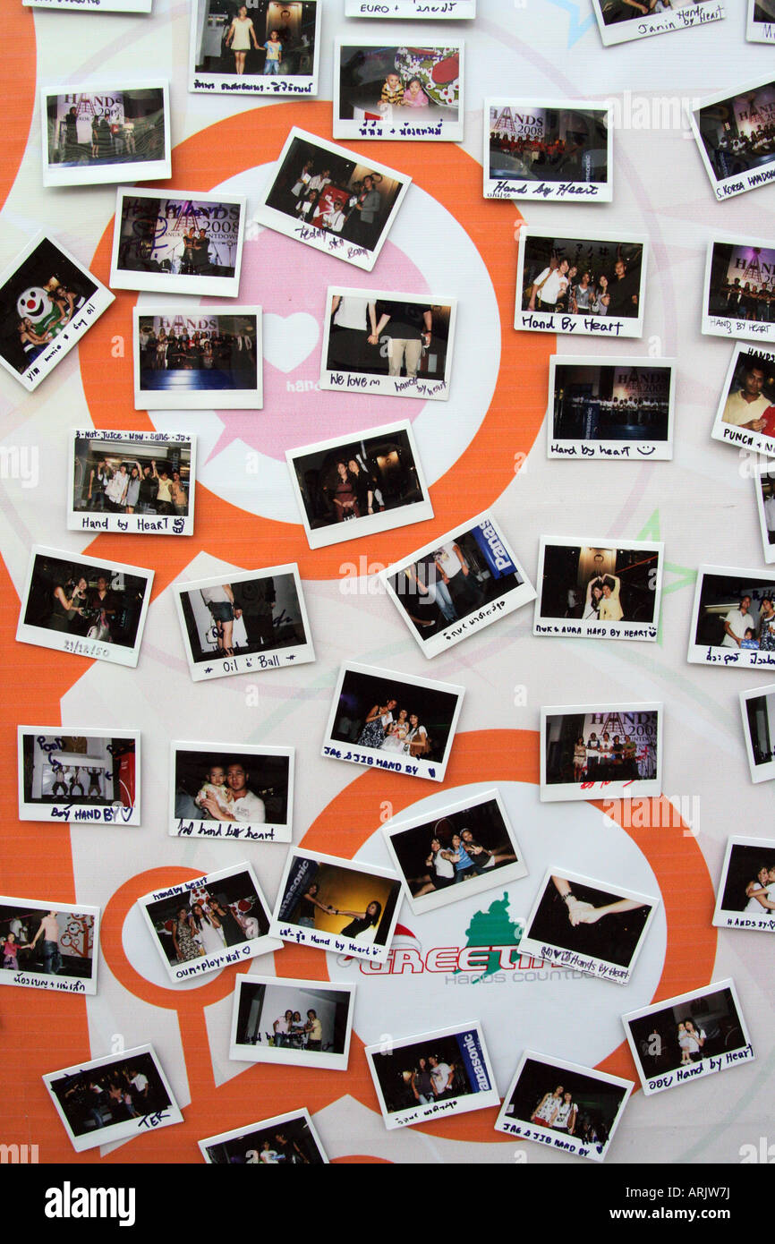 photos on a public display board Stock Photo - Alamy