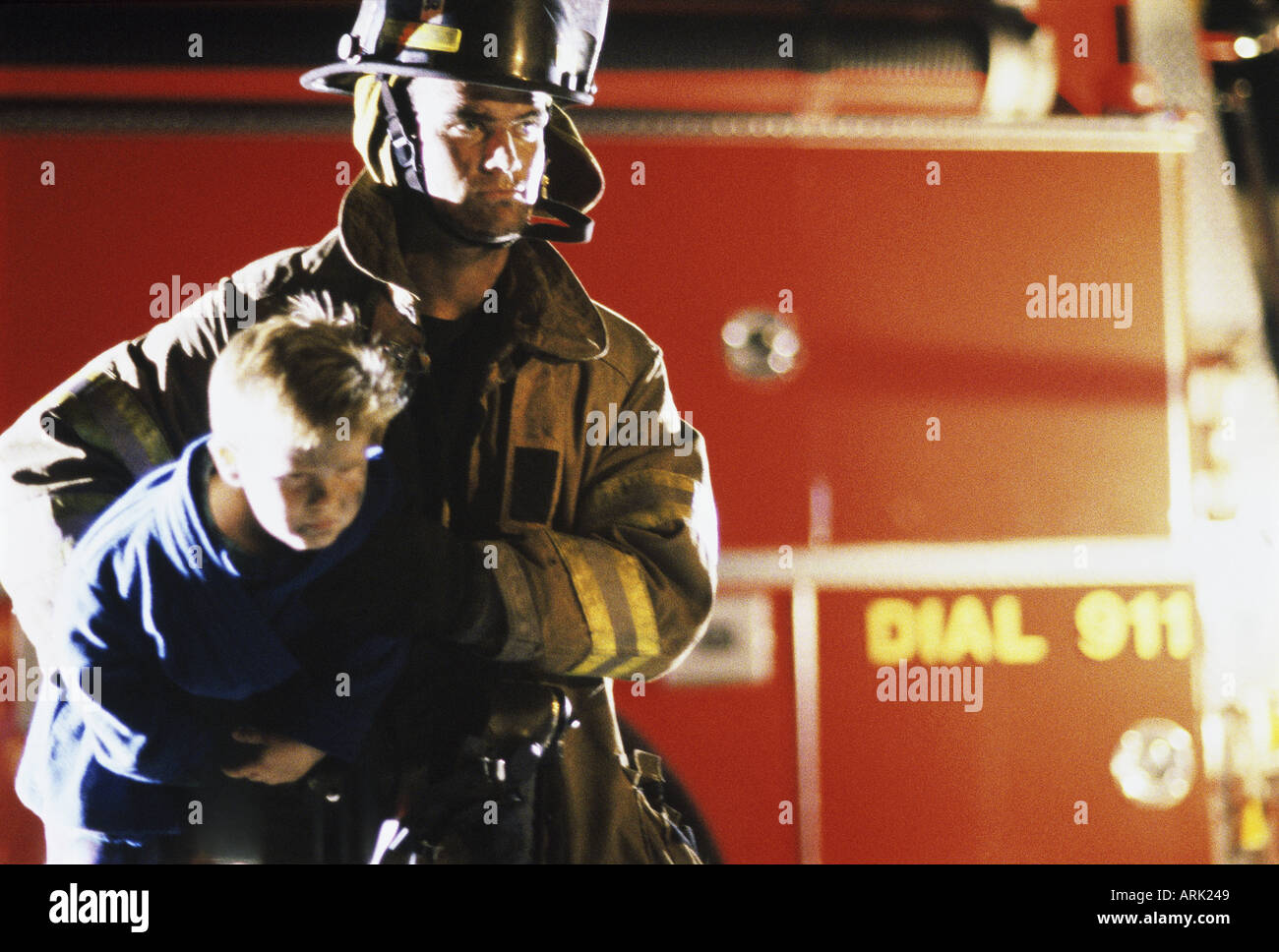 Firefighter rescuing child hi-res stock photography and images - Alamy