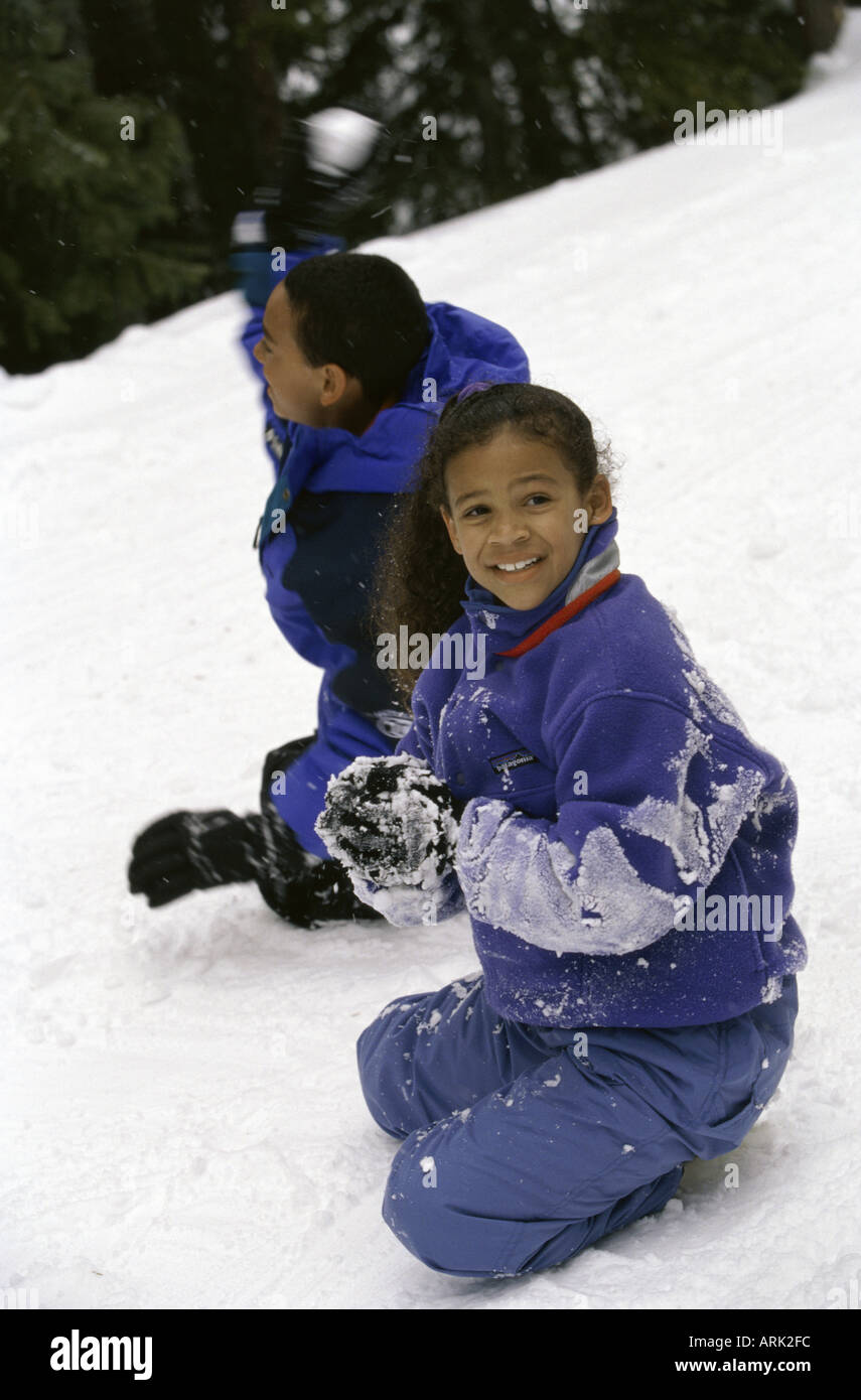 Kids playing snowballs hi-res stock photography and images - Alamy