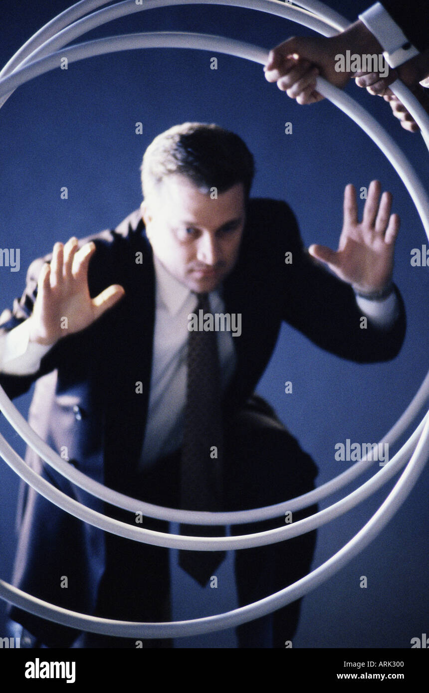 Businessman jumping through hoop hi-res stock photography and images ...