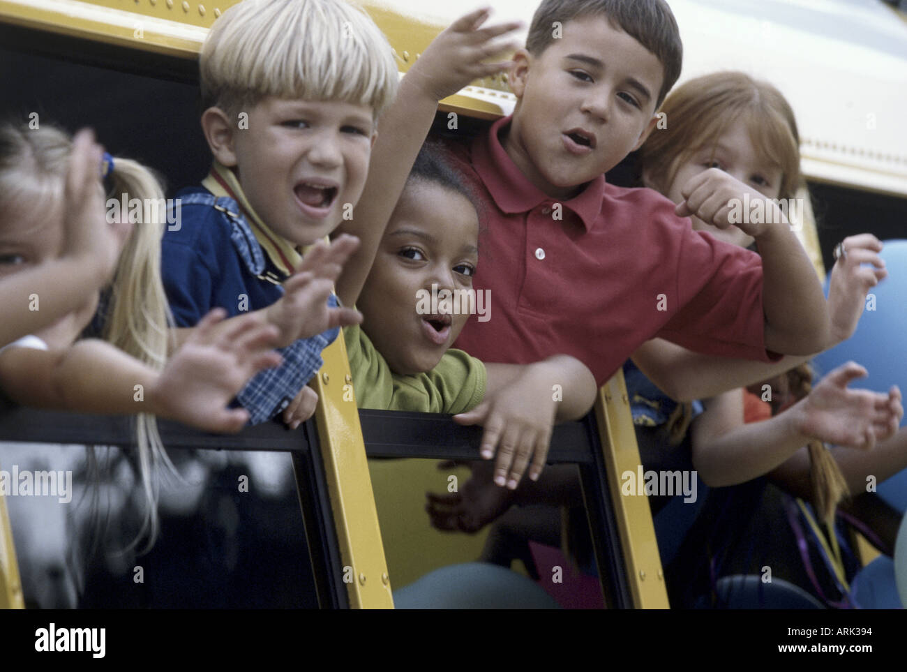 Group of kids waving goodbye hi-res stock photography and images - Alamy