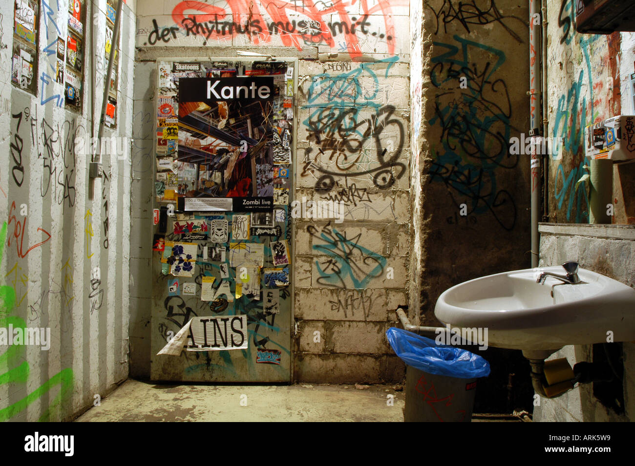 Symbolic photo: mens' toilet with graffities on walls and urinals Stock ...
