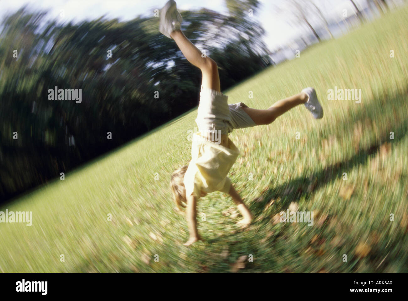 Girl cartwheeling hi-res stock photography and images - Alamy