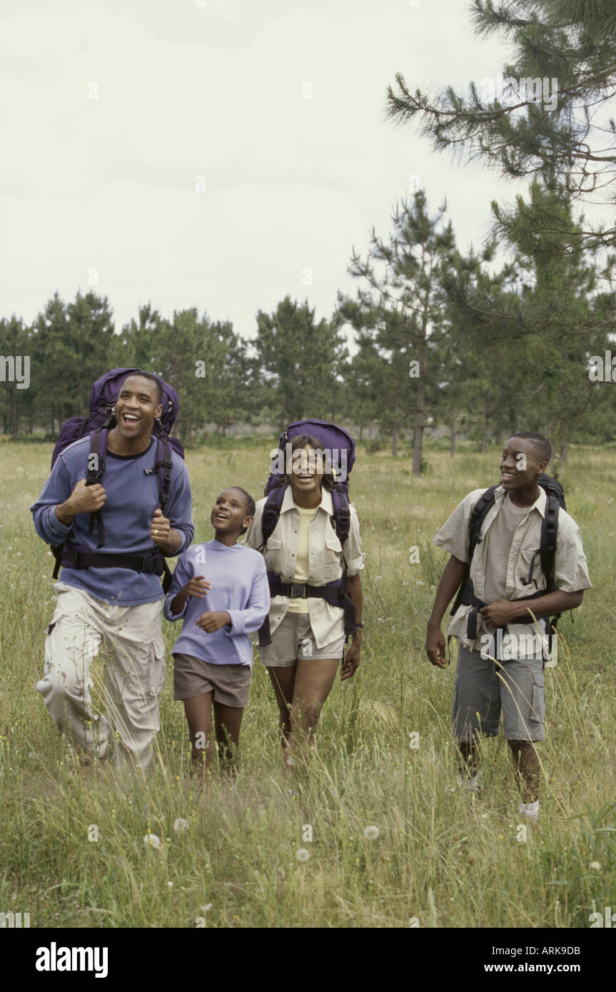Field people smiling walking laughing outdoors Stock Photo - Alamy