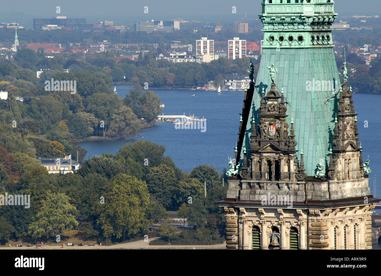 Tower of the city hall of Hamburg, Germany with the lake Alster in the ...