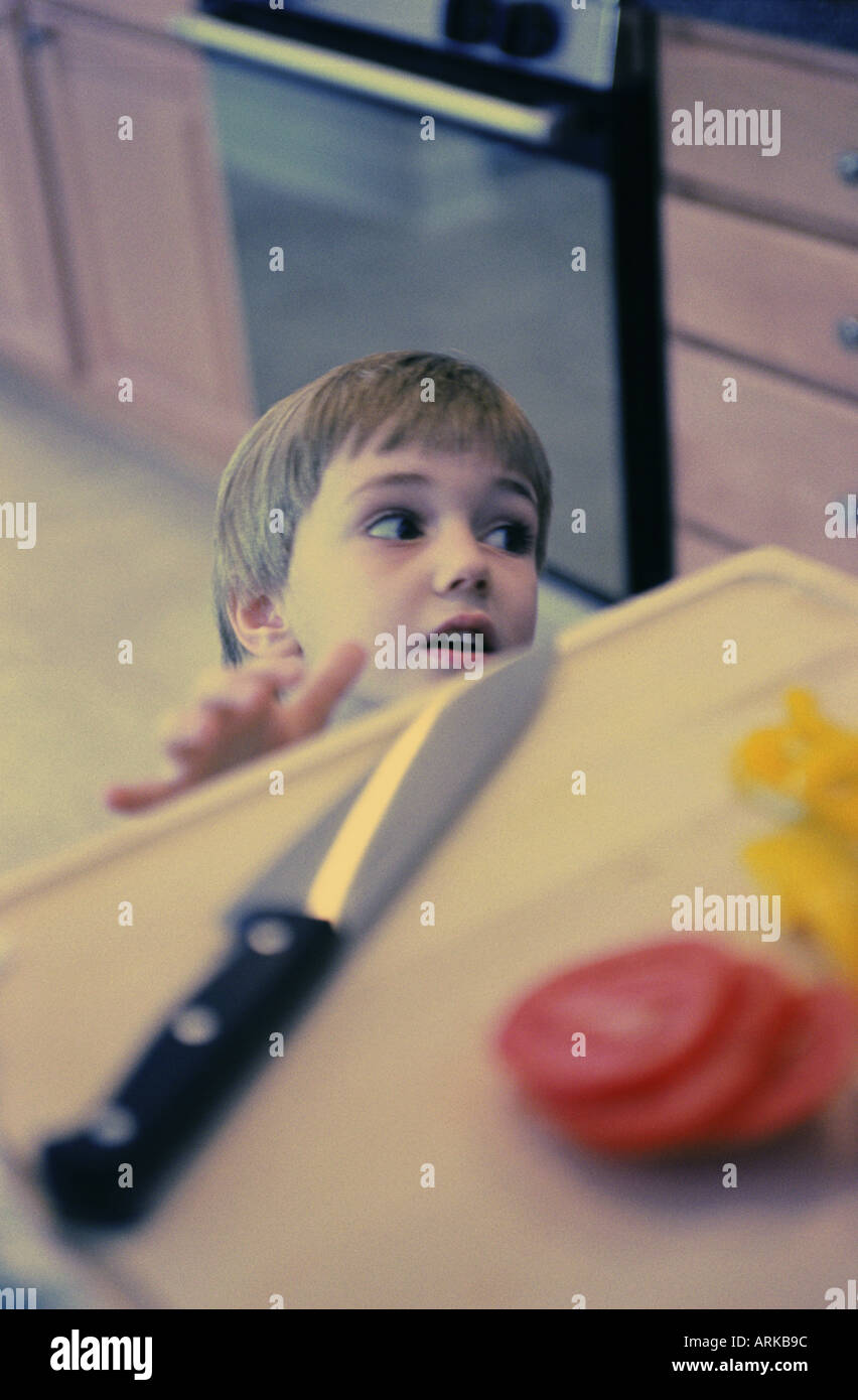 Child reaching knife hi-res stock photography and images - Alamy