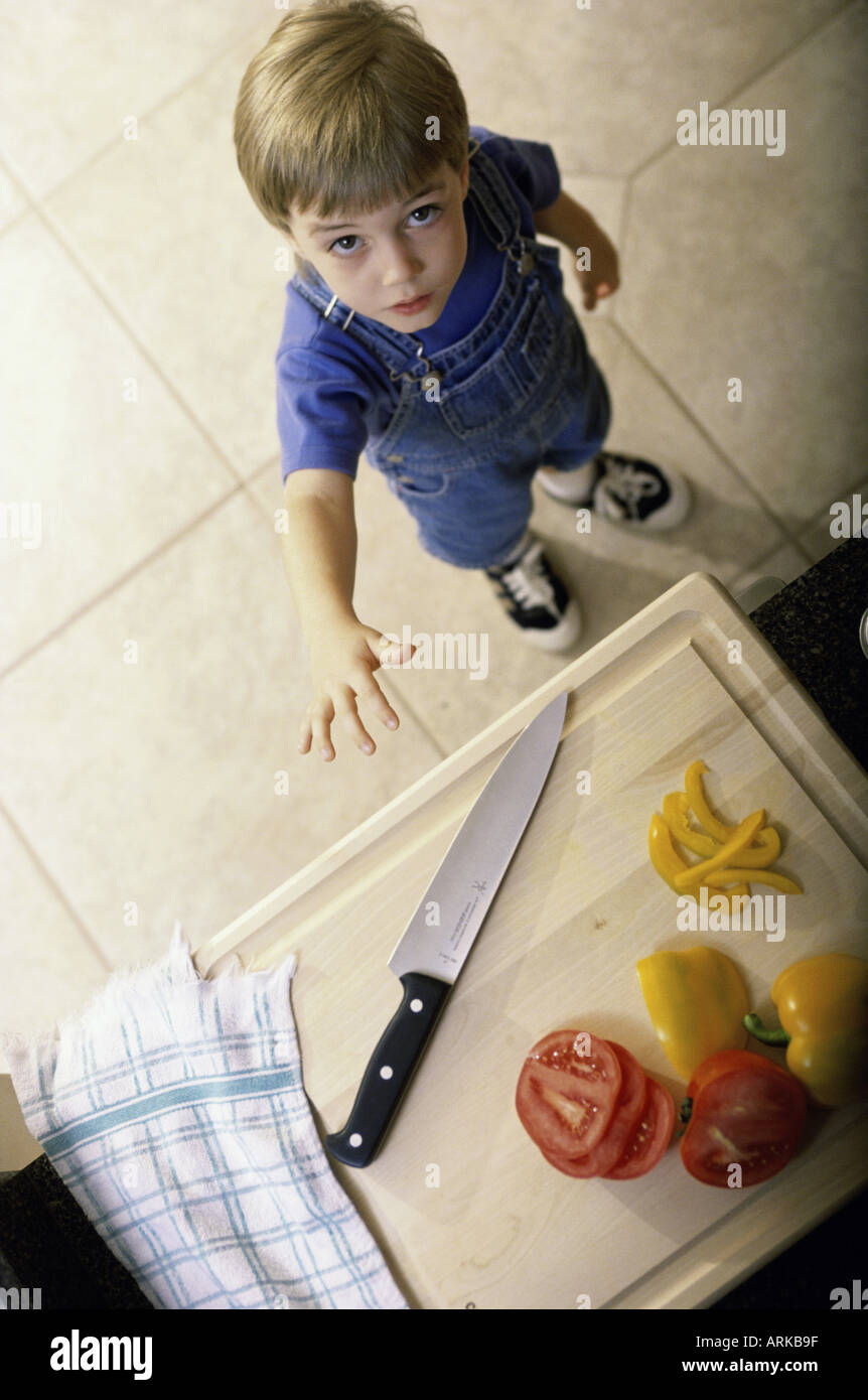 Child reaching knife hi-res stock photography and images - Alamy