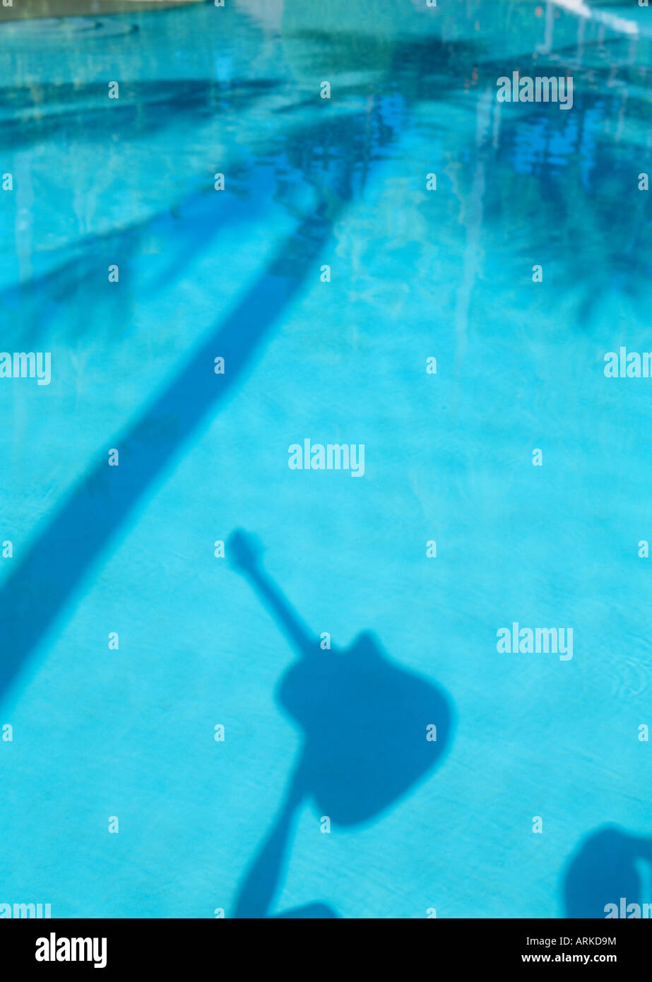Shadow of quitar and the swimming pool Stock Photo - Alamy