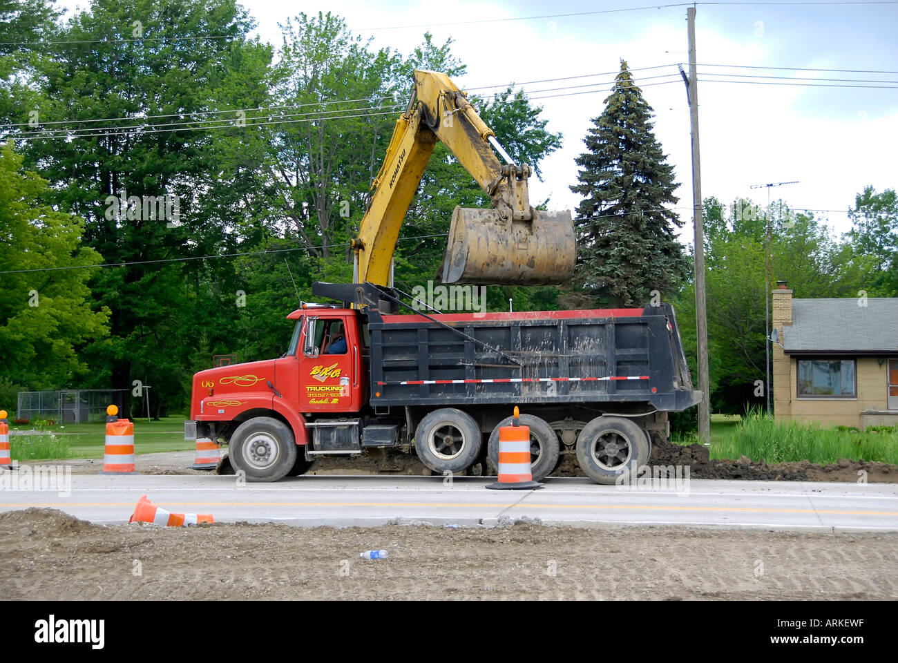 Heavy equipment working on the repair of a road Stock Photo - Alamy