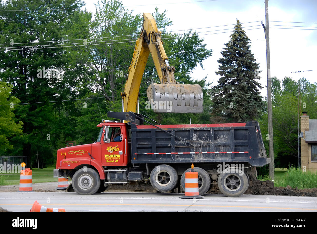 Heavy equipment working on the repair of a road Stock Photo - Alamy